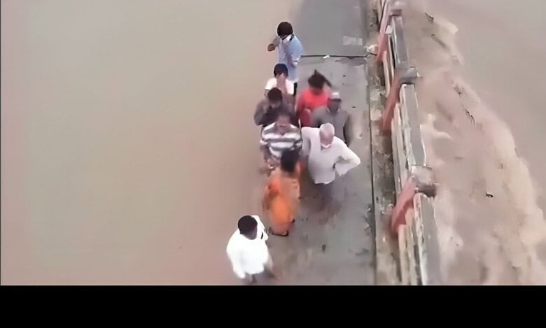 Watch: Amid heavy rains in Telangana, brave Subhan Khan risks life to ...